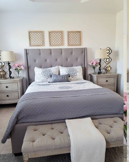 Grey upholstered bed with white furniture store